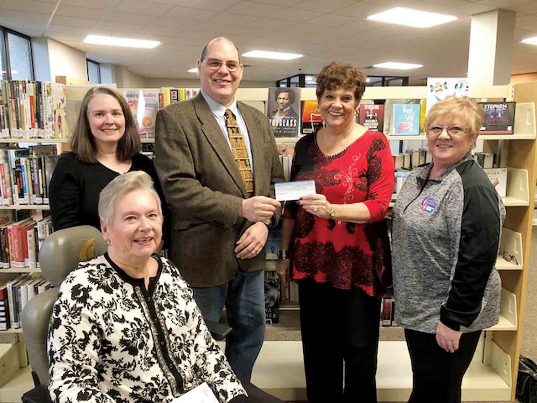 Junior League revisits library project as part of 95th anniversary ...